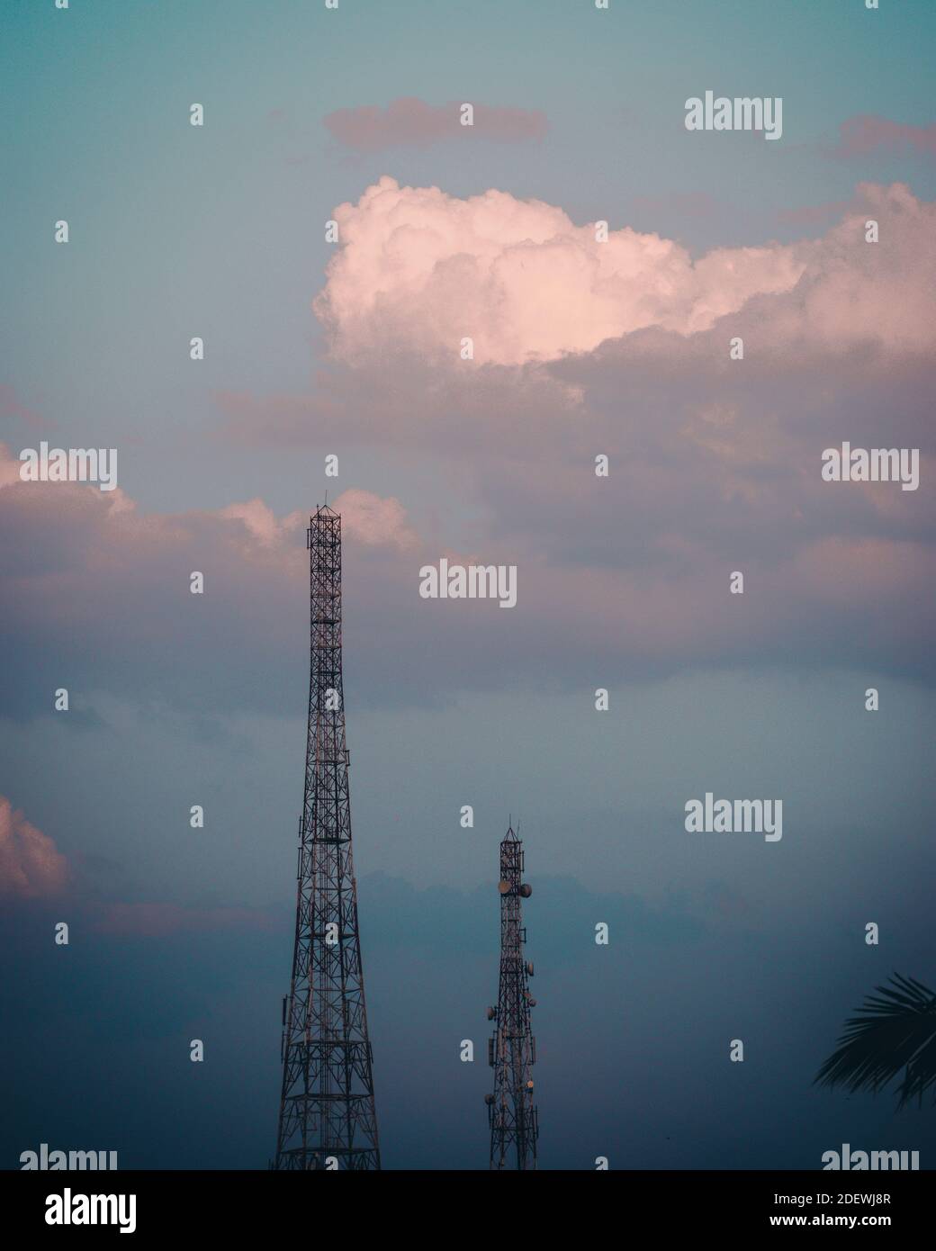 Telecom towers with beautiful clouds Stock Photo - Alamy