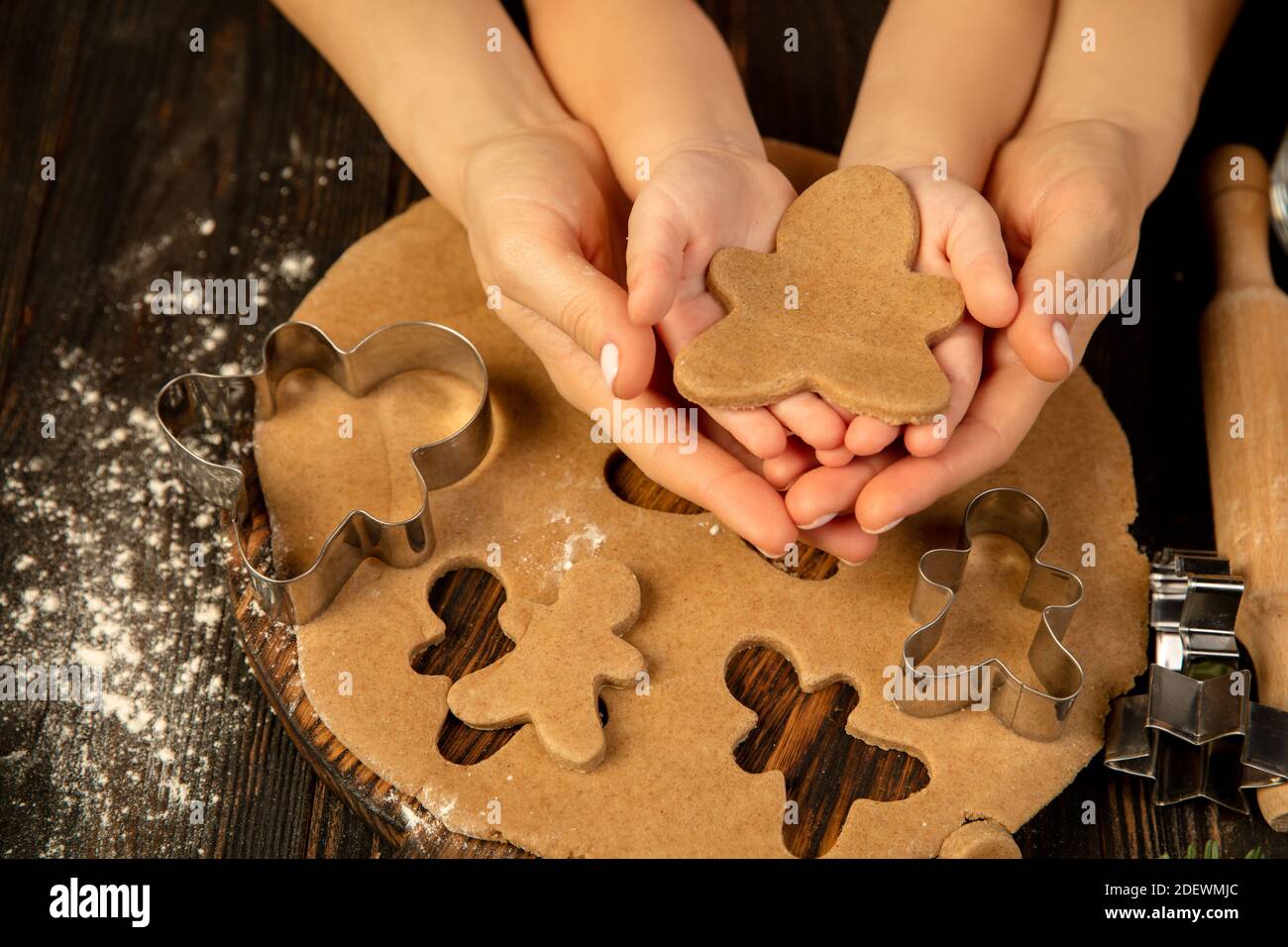 Christmas gingerbread man in child hands. Holiday, family, home comfort ...