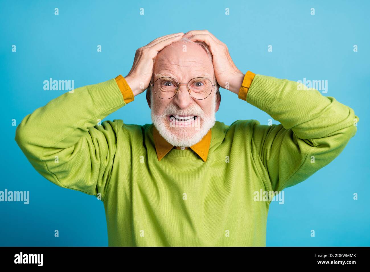 Photo of aggressive retired old man hands head mad look wear glasses ...