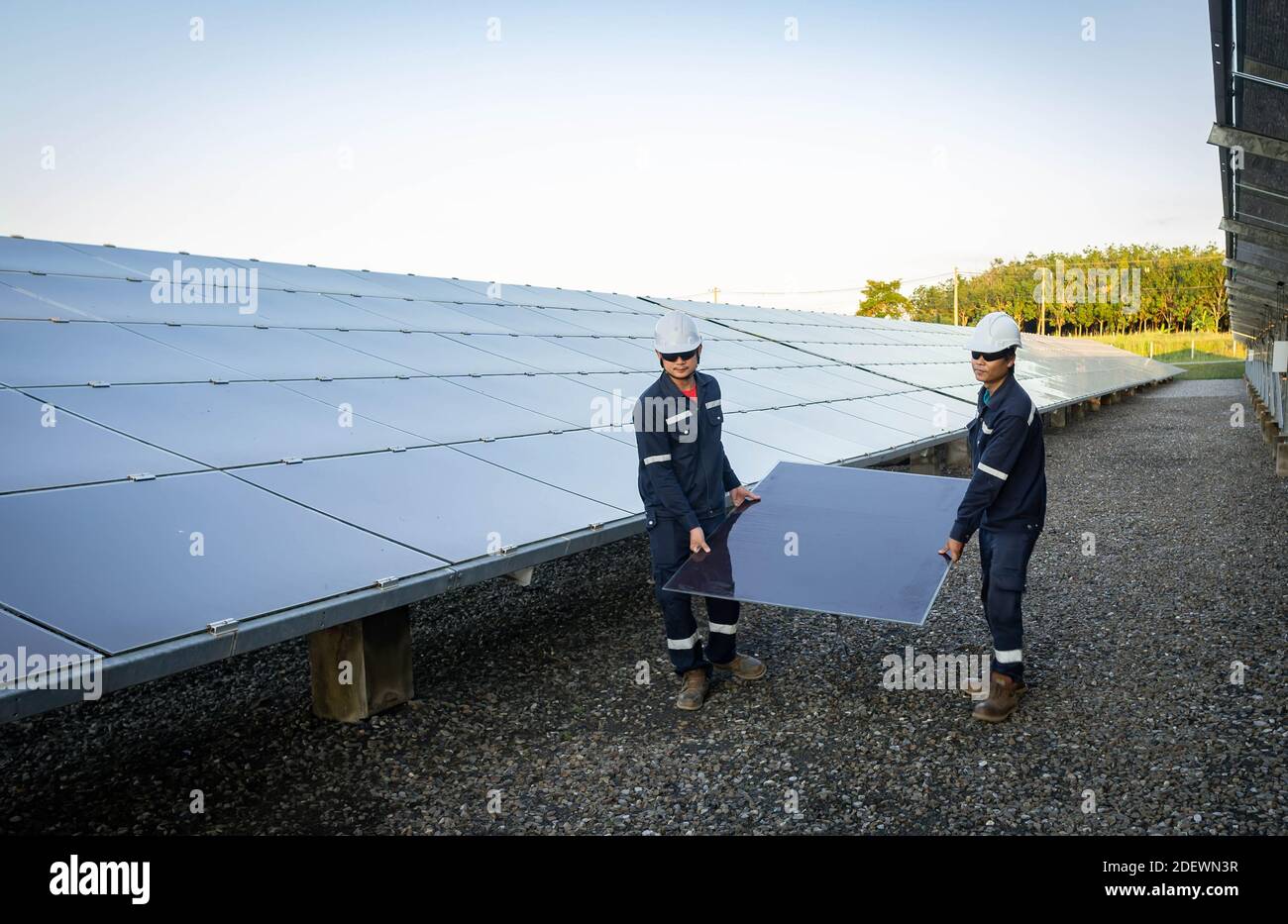 Technician is lifting the solar cell to replace the damaged one ...