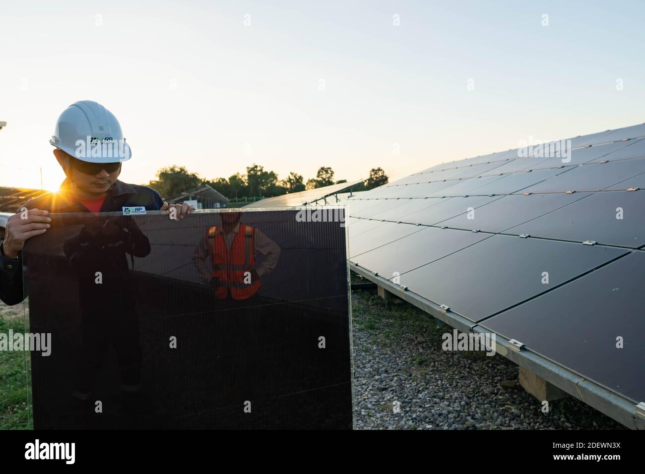 Technician is lifting the solar cell to replace the damaged one ...