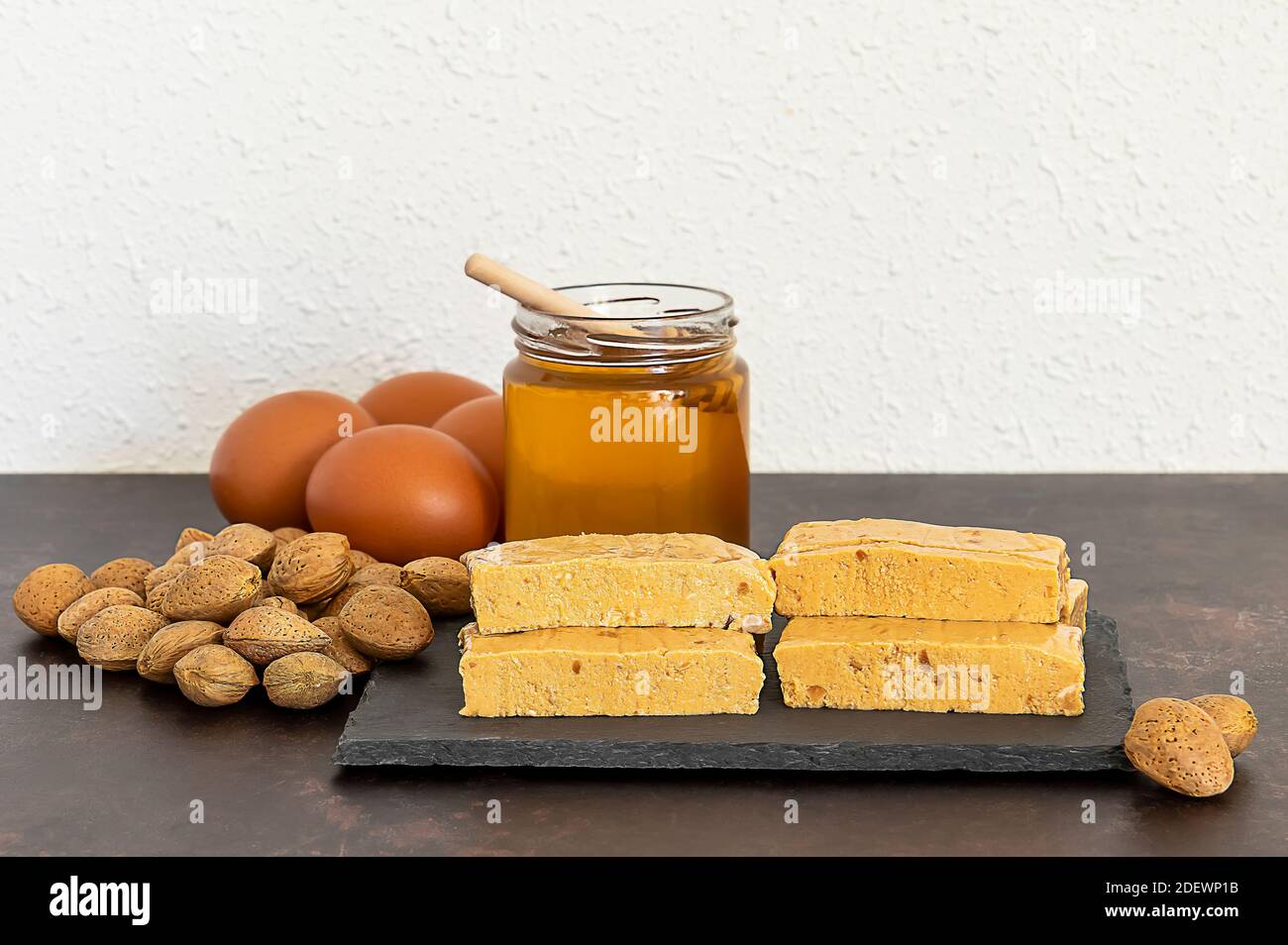 Turron, typical Christmas sweet in Spain. Almond nougat on the black ...