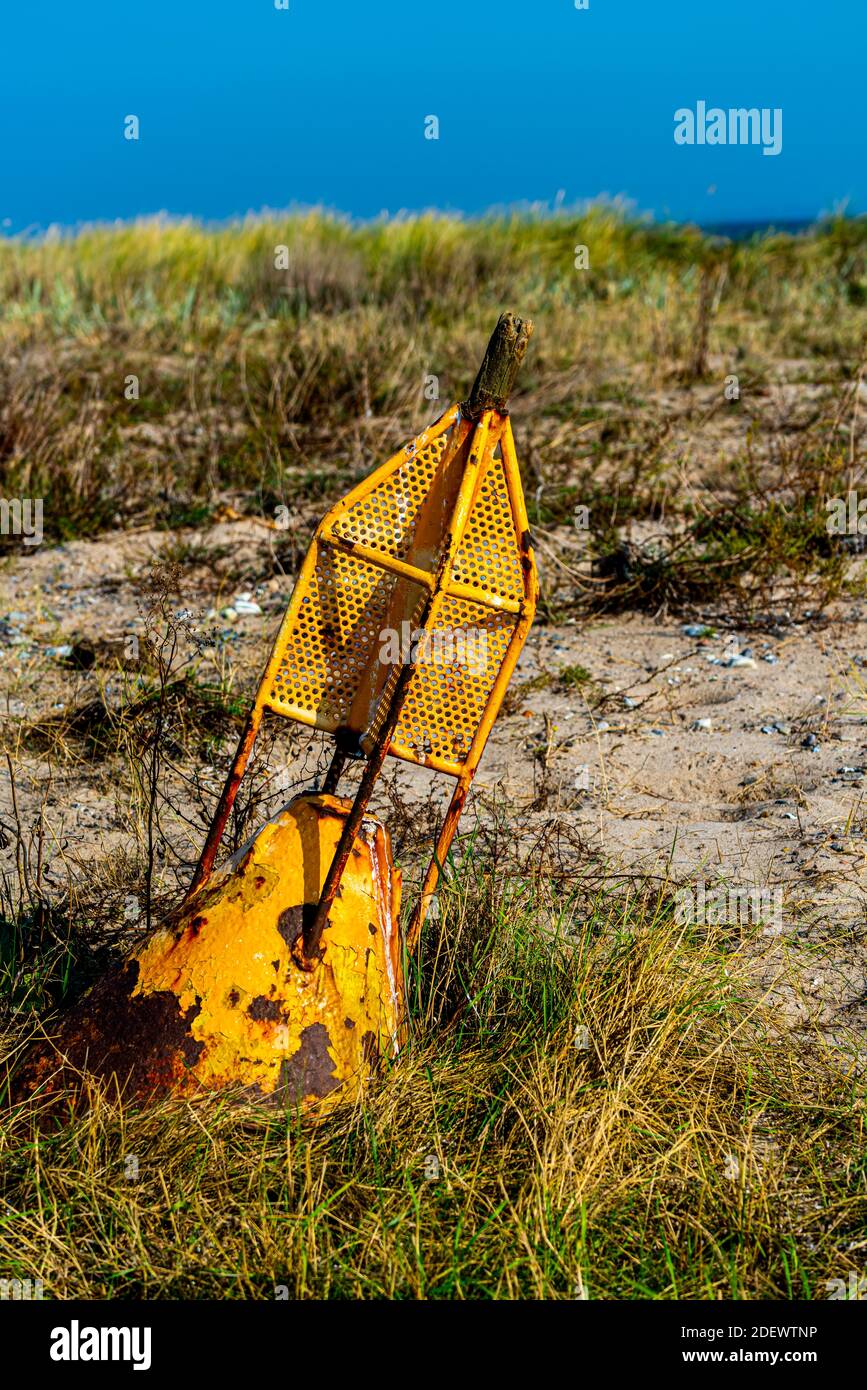 Old maritime marking buoy stranded on a beach after a storm Stock Photo ...