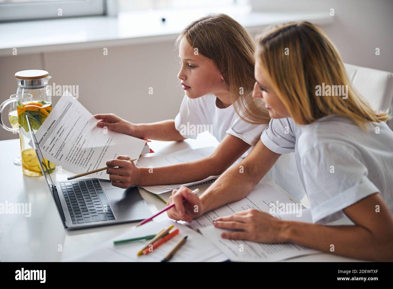 Teenager checking her test results with her parent Stock Photo - Alamy