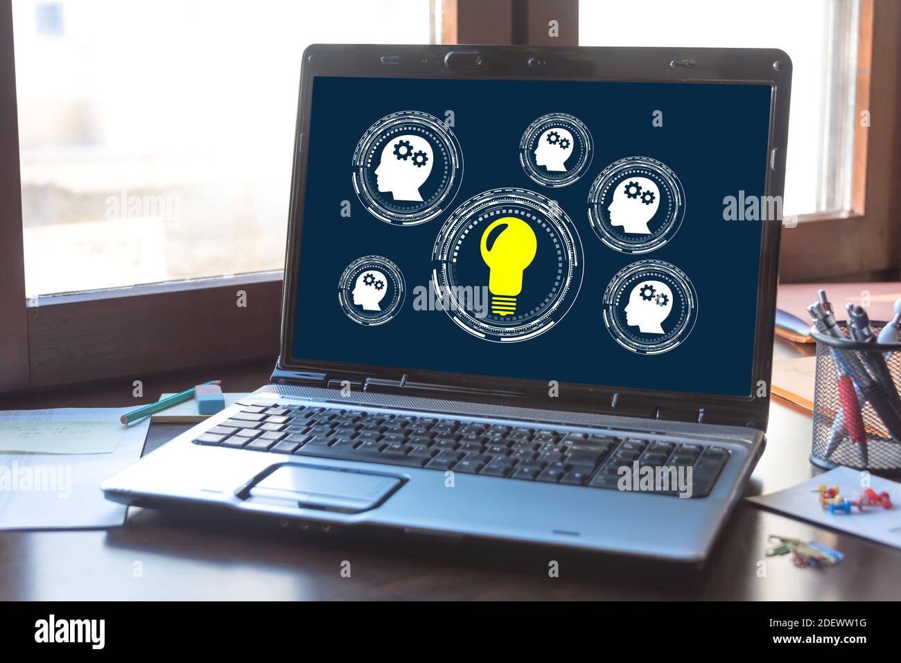 Laptop screen displaying a teamwork idea concept Stock Photo - Alamy