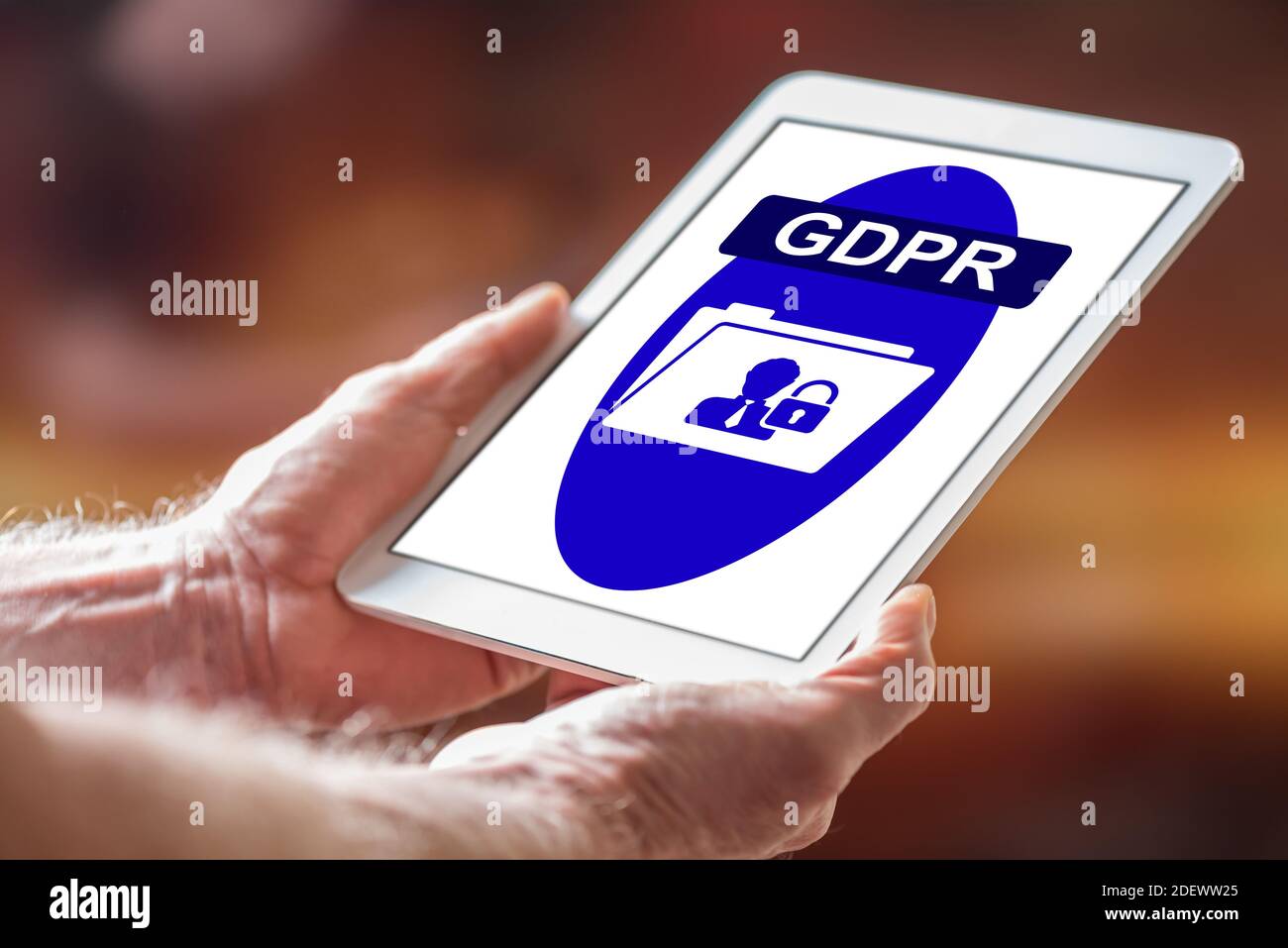 Man holding a tablet showing gdpr concept Stock Photo - Alamy