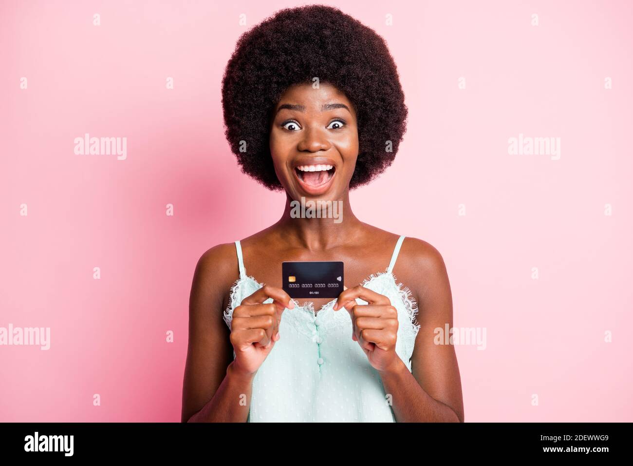 Portrait of cheerful brown haired lady hold debit card happy customer ...
