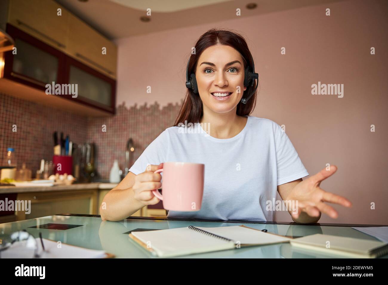 Lady with a teacup asking for explanations Stock Photo - Alamy