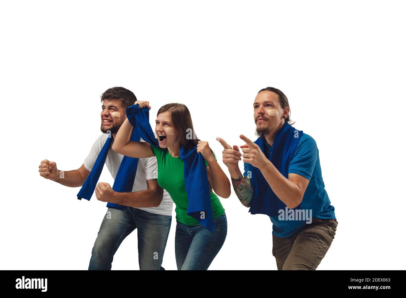 Teamwork and win. Female and male soccer fans cheering for favourite ...