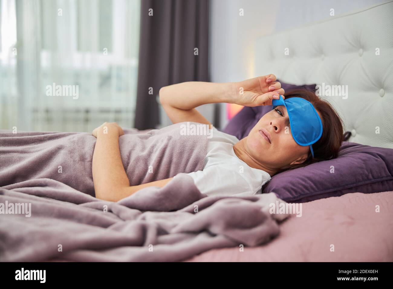 Sleepy female waking up from a nap Stock Photo - Alamy