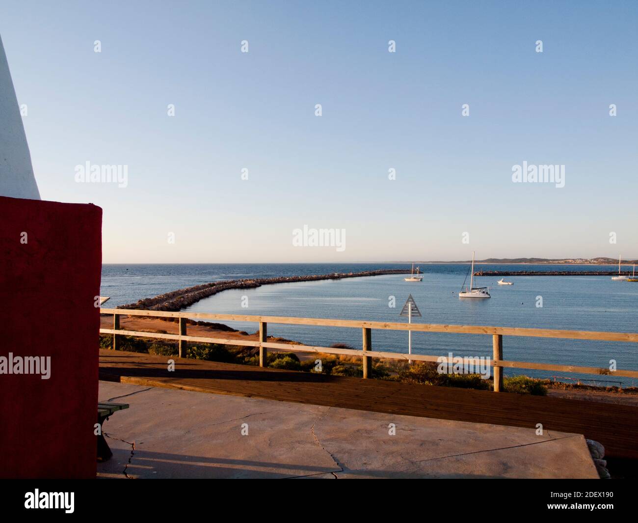 Port Denison harbour and breakwaters at sunset from Fishermens Memorial ...