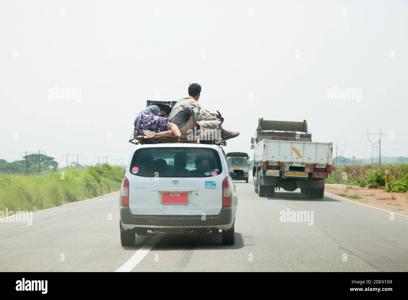 Travelling by car on the road to the Golden Rock, state of Mon, Myanmar ...