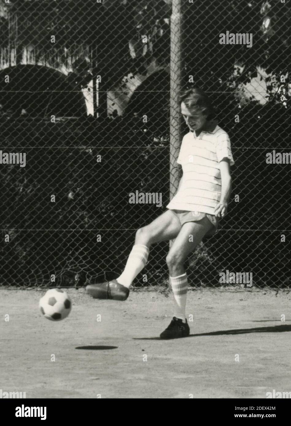 Italian businessman Luca Cordero di Montezemolo playing football, 1980s ...