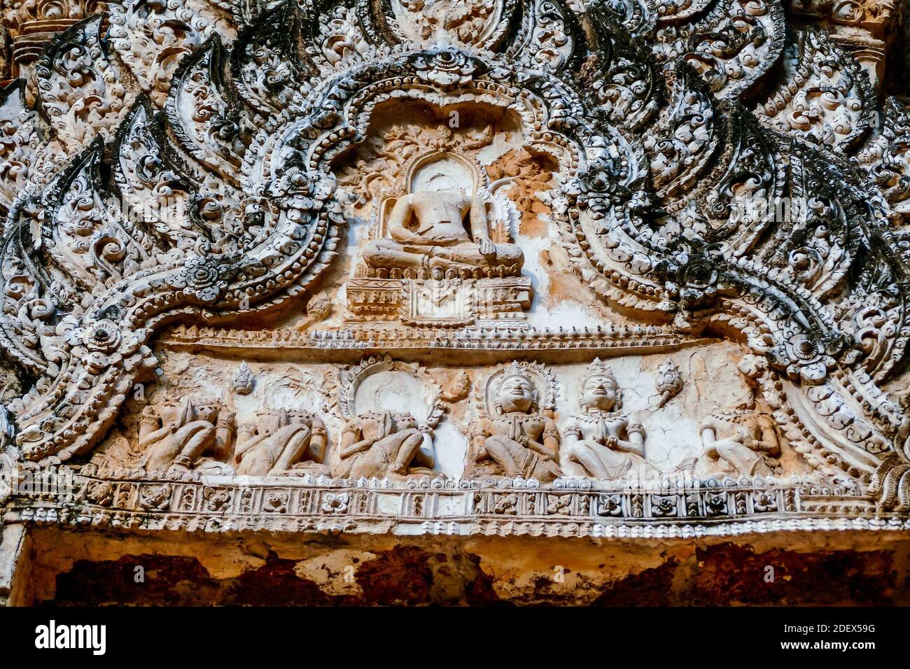 A closeup architectural detail of an old Thai temple with religious ...