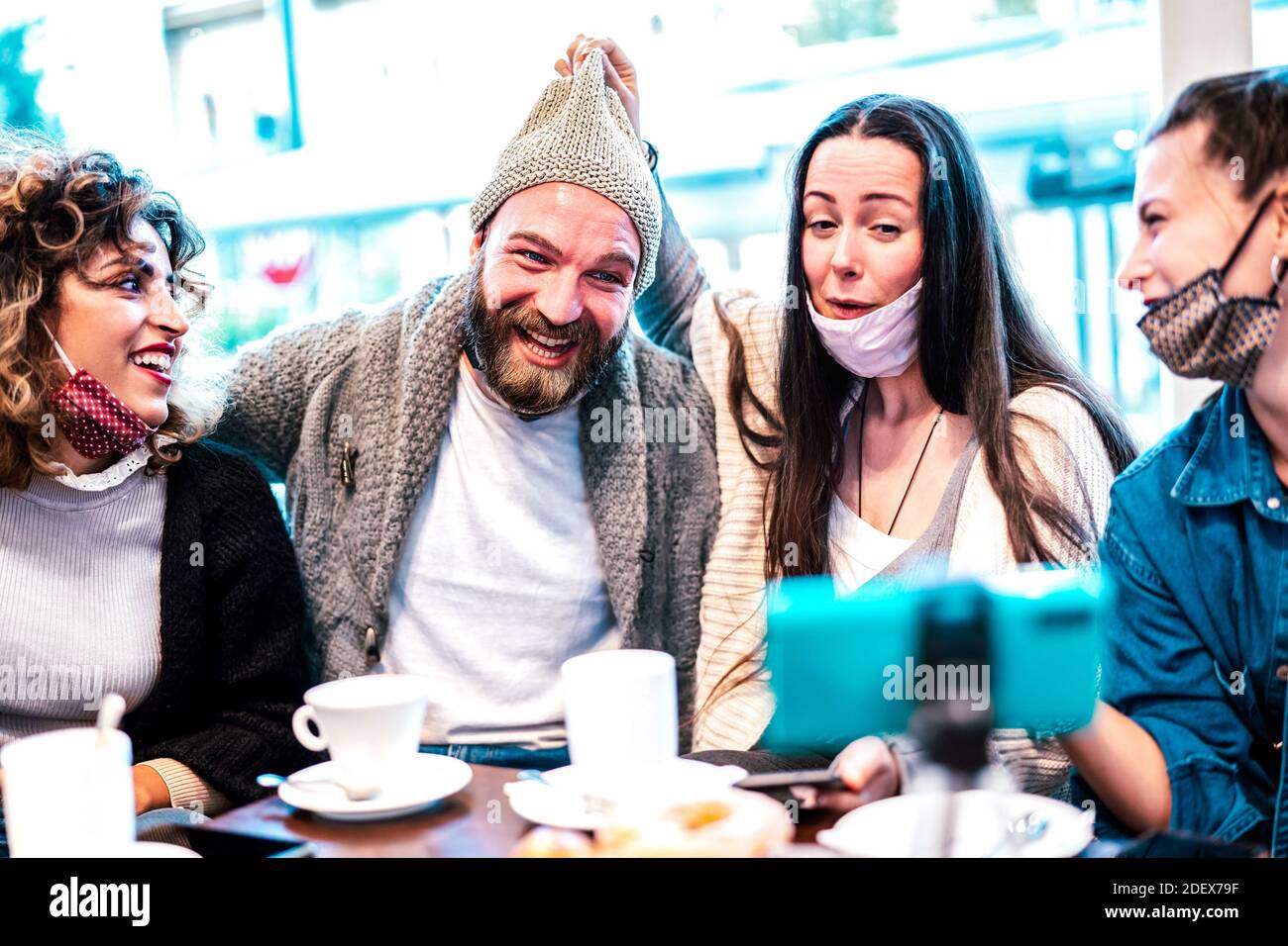 Young happy people sharing content on streaming platform wearing open ...