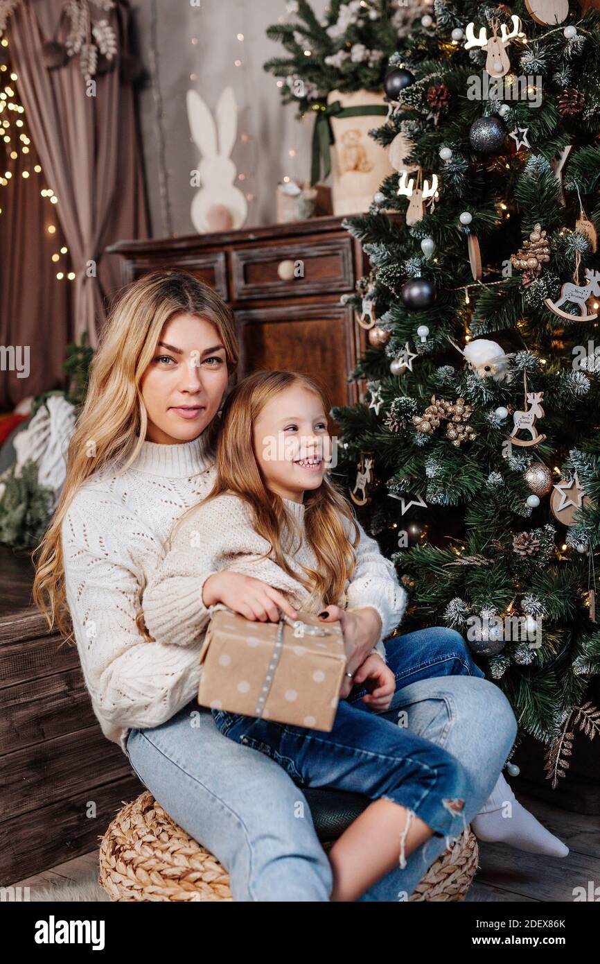 happy family open presents on Christmas morning near tree Stock Photo ...