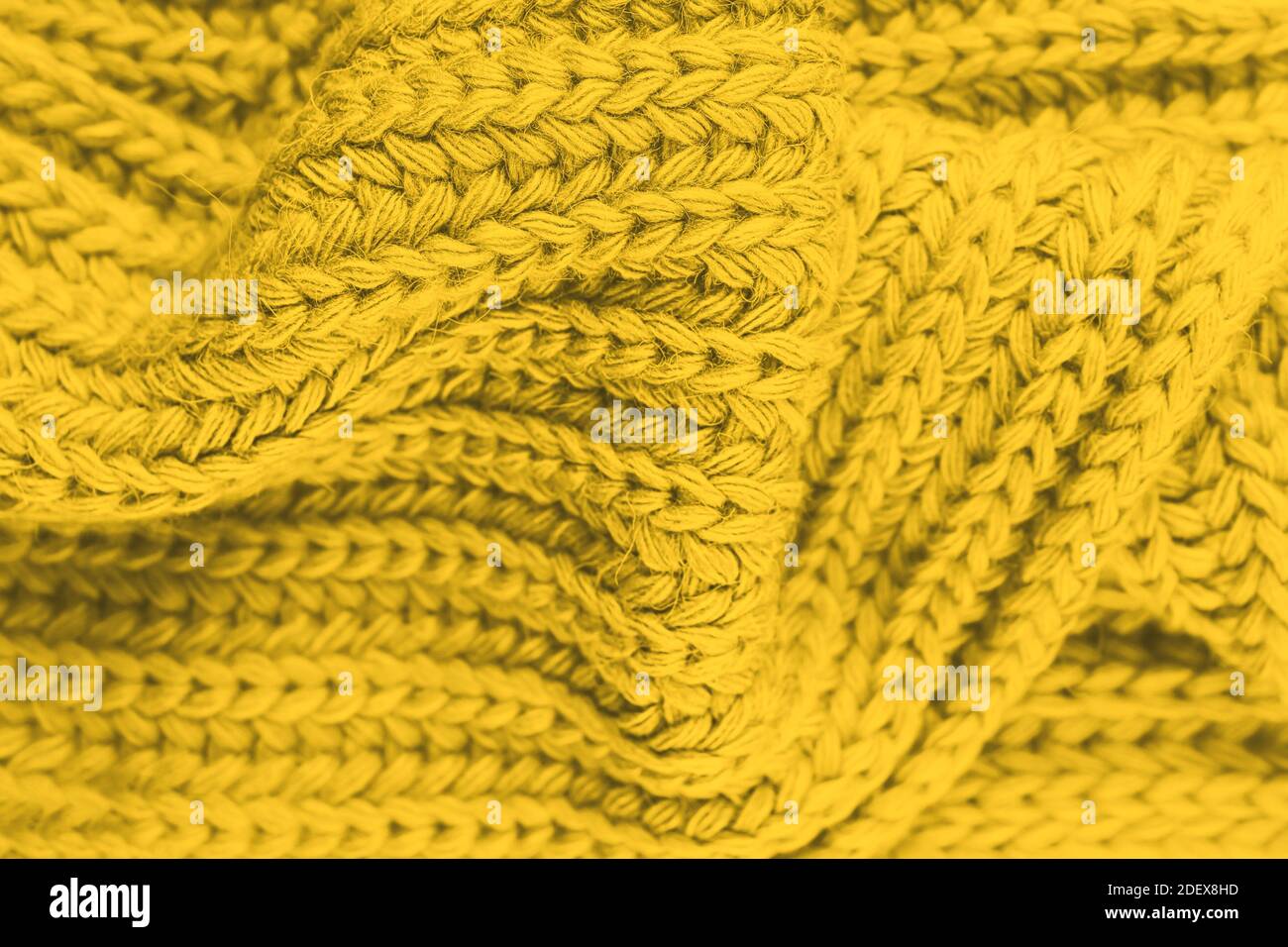 Yellow mustard color knitted fabric background Stock Photo - Alamy