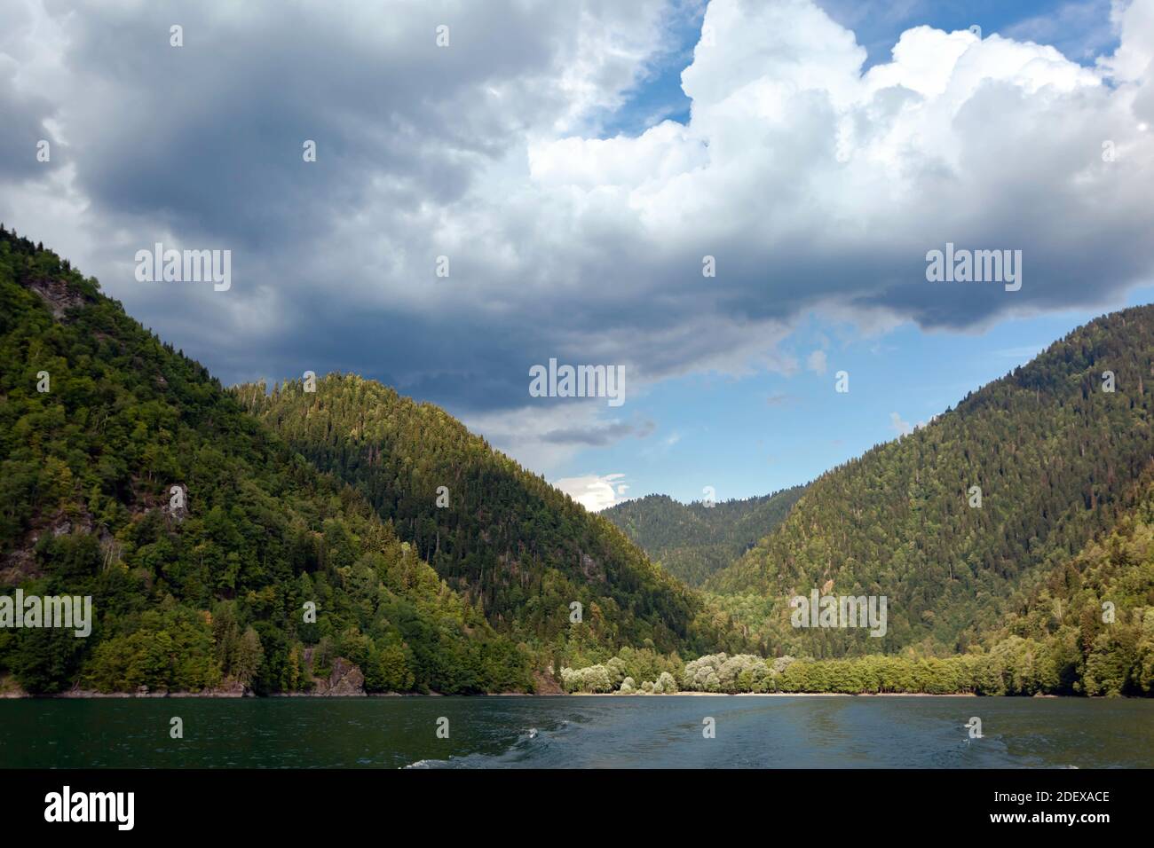 Beautiful high mountains against a blue sky with clouds Stock Photo - Alamy