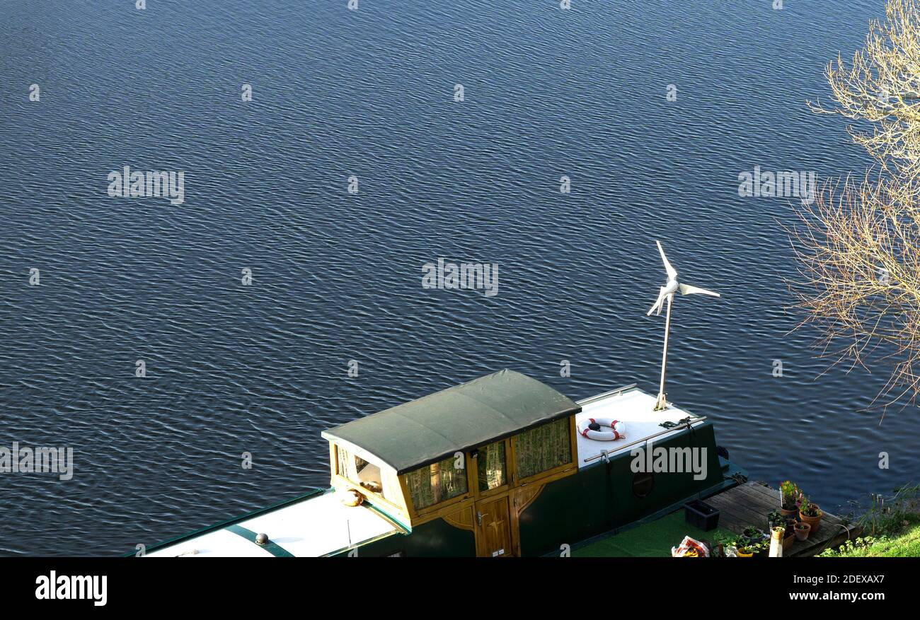 House boat with small wind turbine Stock Photo - Alamy