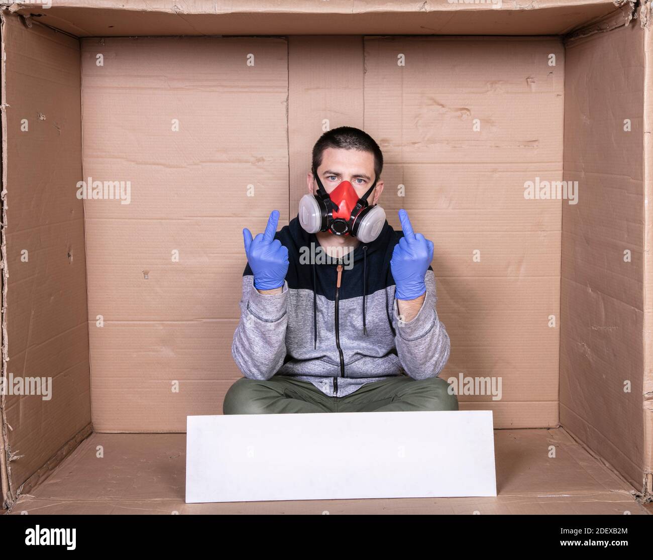 man in a protective mask shows the middle finger Stock Photo - Alamy