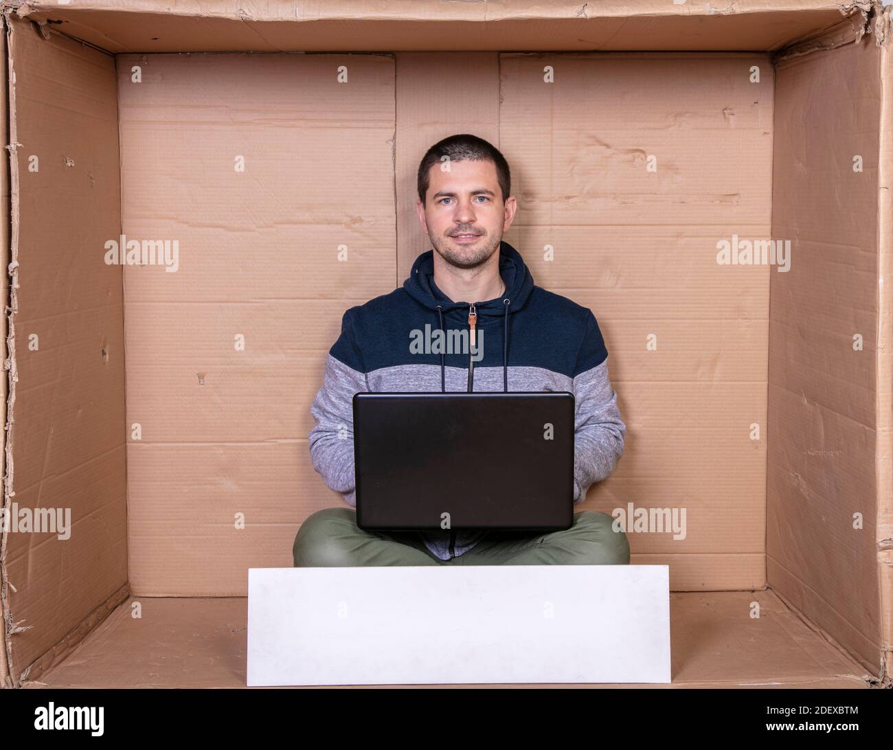 young boy working on a computer in a cardboard office Stock Photo - Alamy