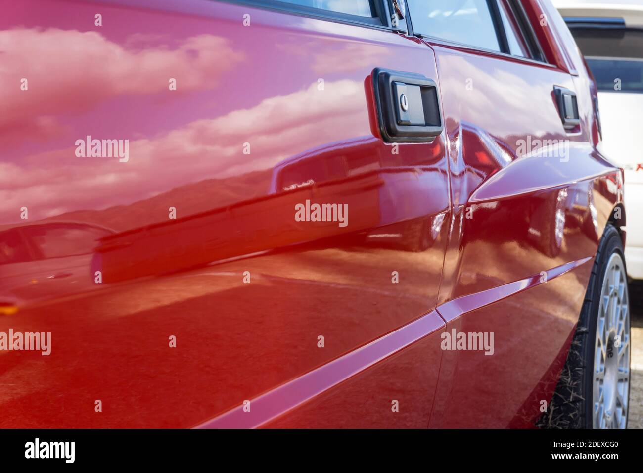 Close up detail of the side of a red Lancia Delta HF integrale ...