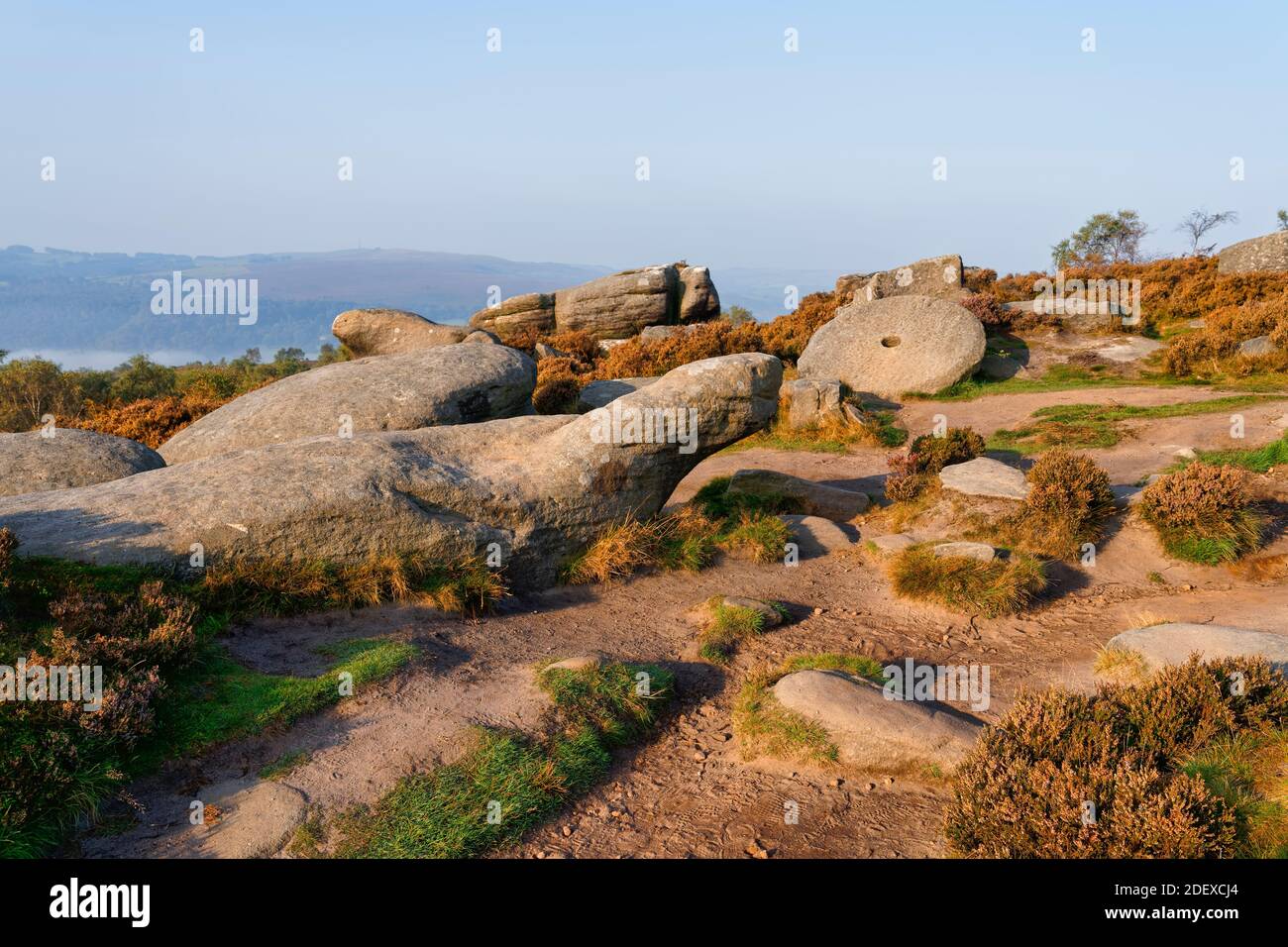 Strange shaped rocks bathed in autumn sunlight high in the misty ...