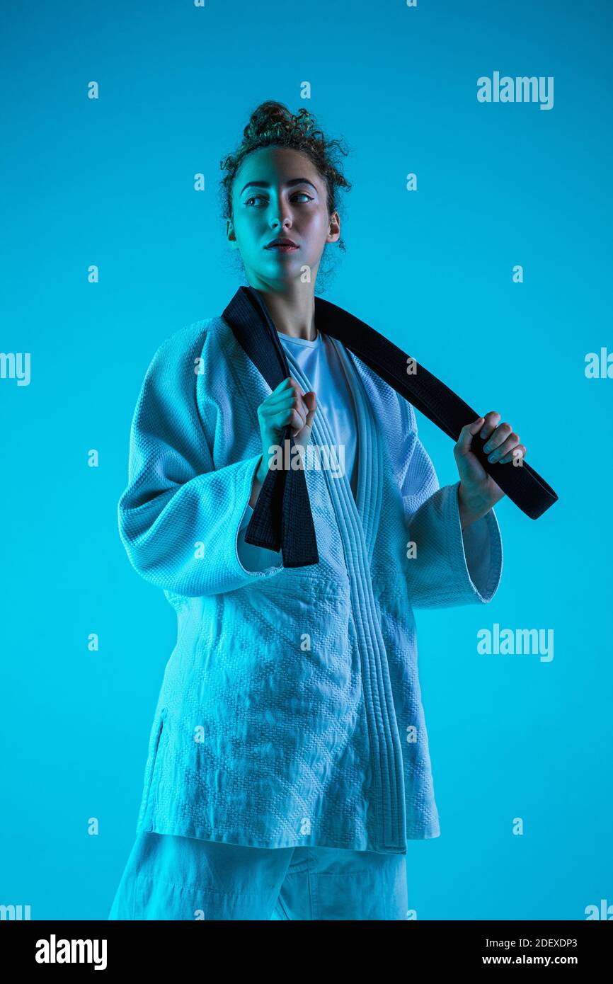 Take a rest. Professional female judoist in white judo kimono ...