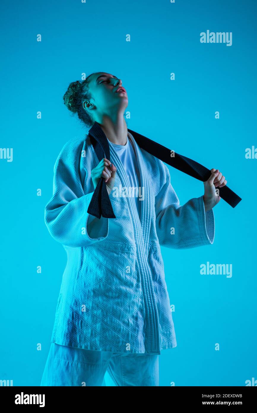 Take a rest. Professional female judoist in white judo kimono ...