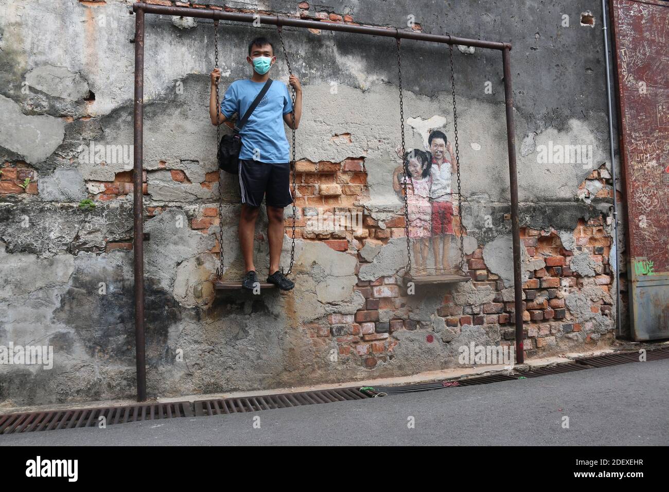 GEORGETOWN, MALAYSIA - Nov 28, 2020: Asian man standing.Street art ´Boy ...