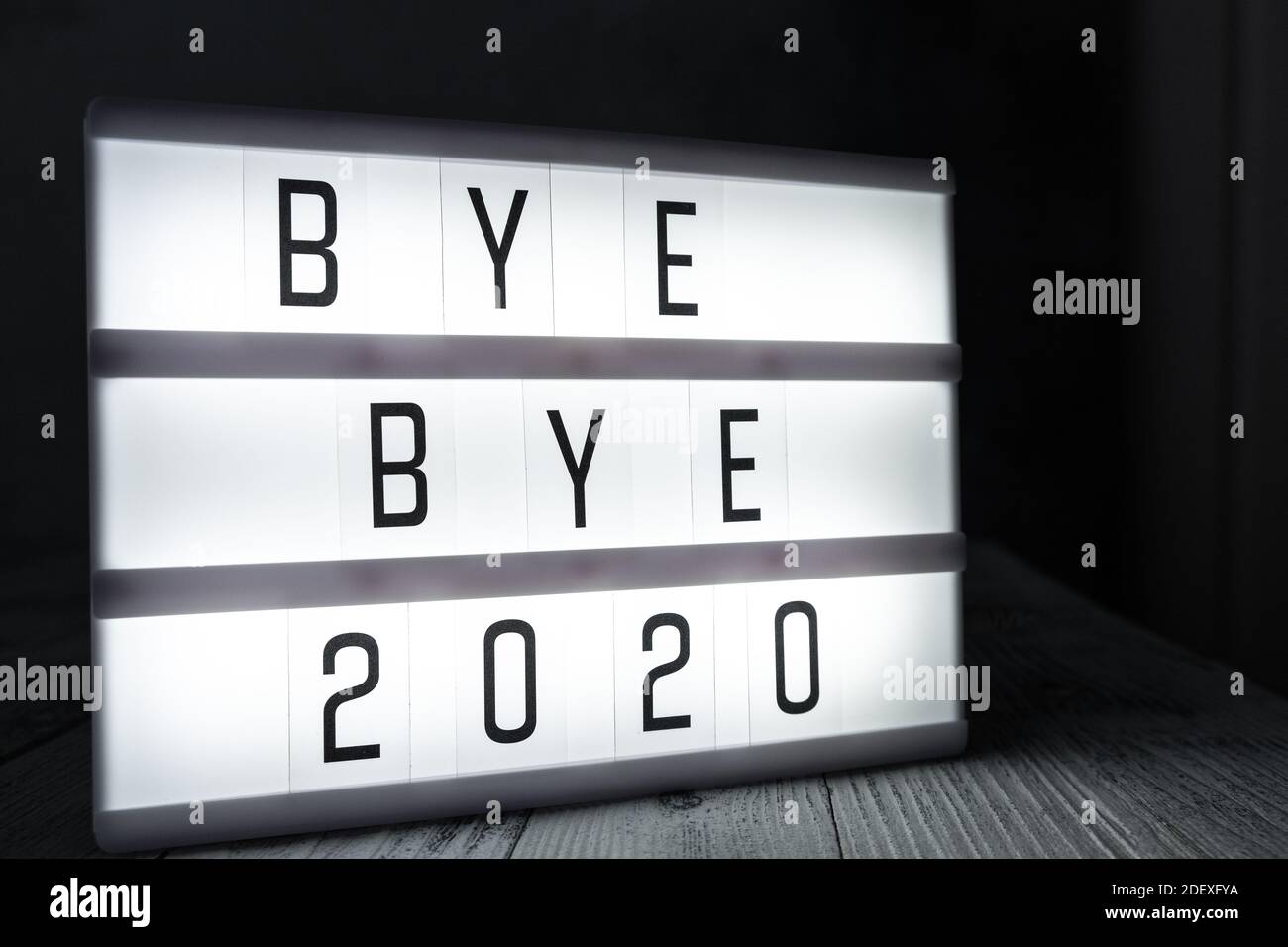 Lightbox with text BYE BYE 2020 in dark room. Hope, new life and Happy ...