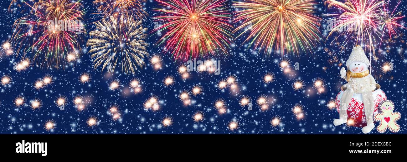 Christmas widescreen background with fireworks, snow and a fun toy ...