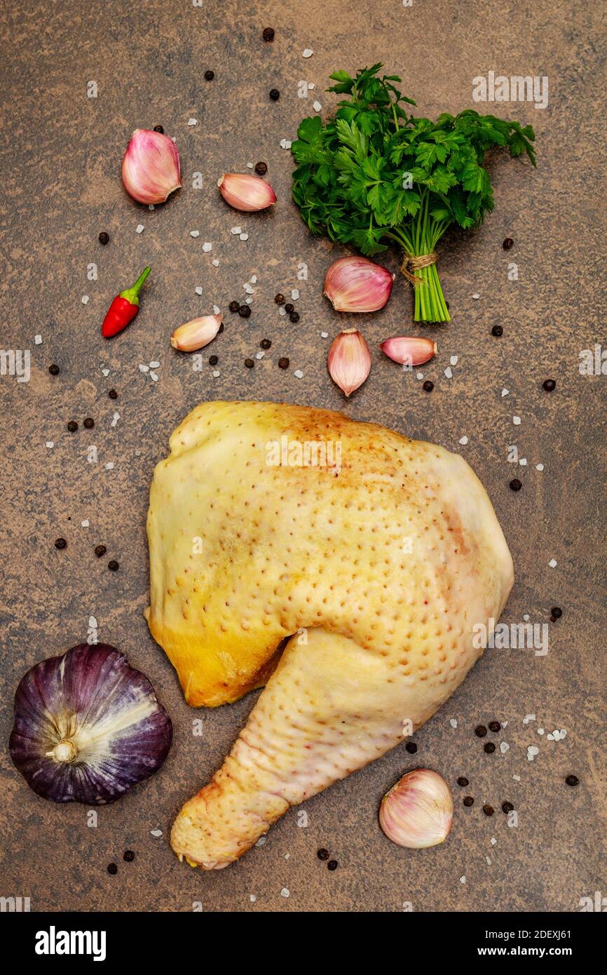 Clean food concept. Parts of organic chicken (leg) with yellowish skin ...