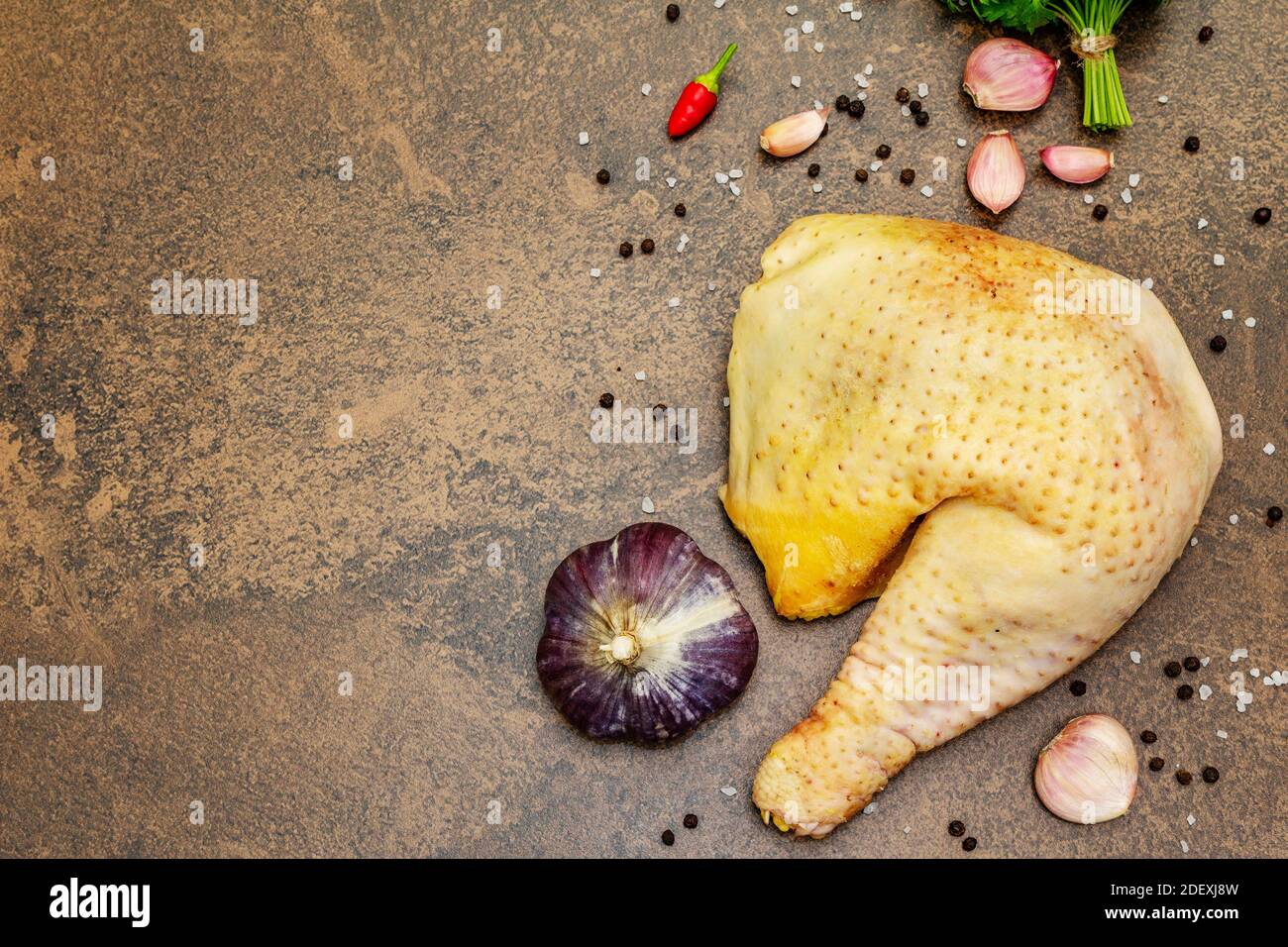 Clean food concept. Parts of organic chicken (leg) with yellowish skin ...