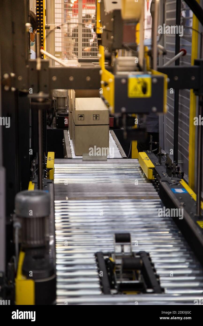 Automatic carton, cardboard tape sealing machine. Industrial logistics ...