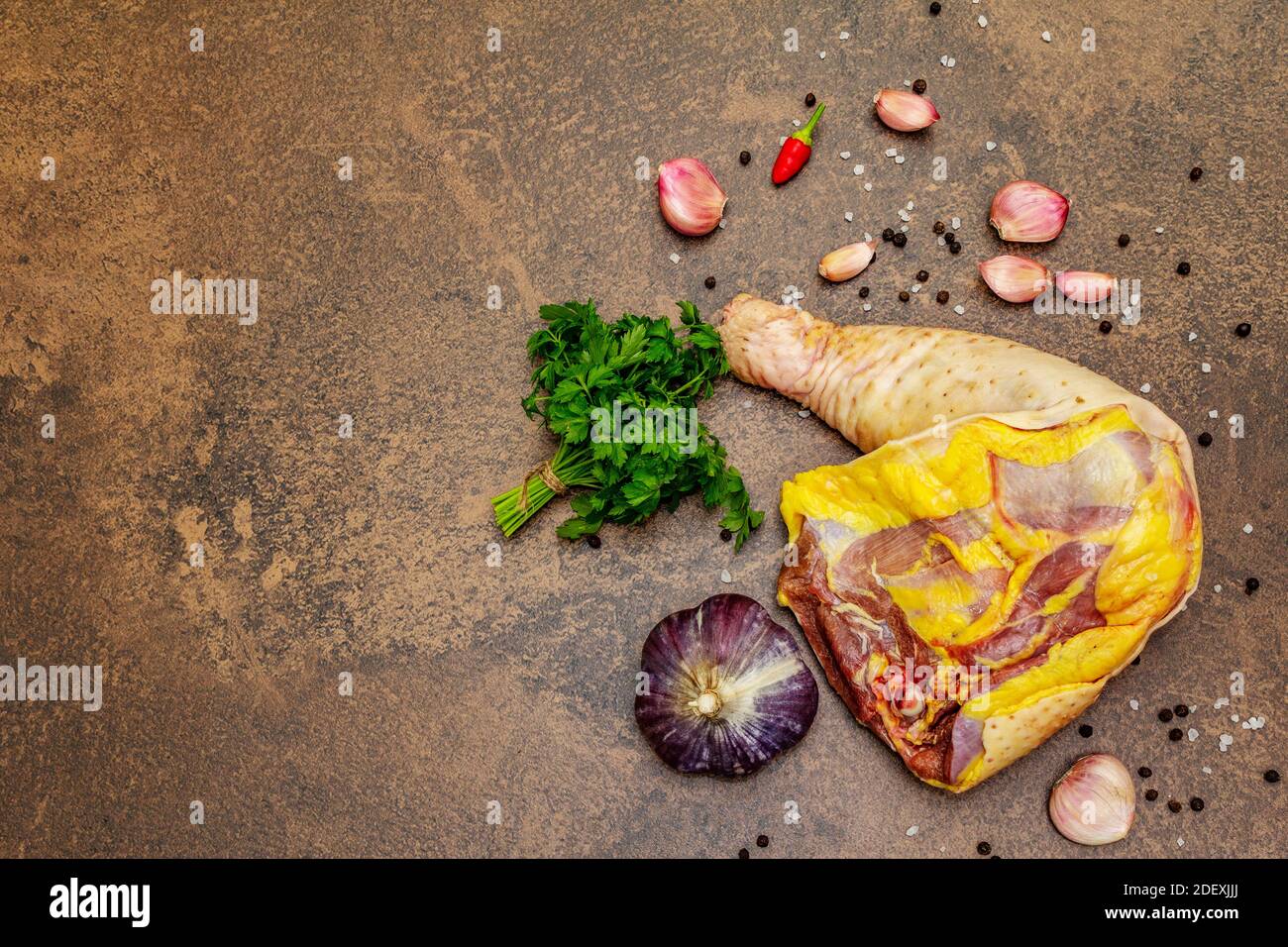 Clean food concept. Parts of organic chicken (leg) with yellowish skin ...