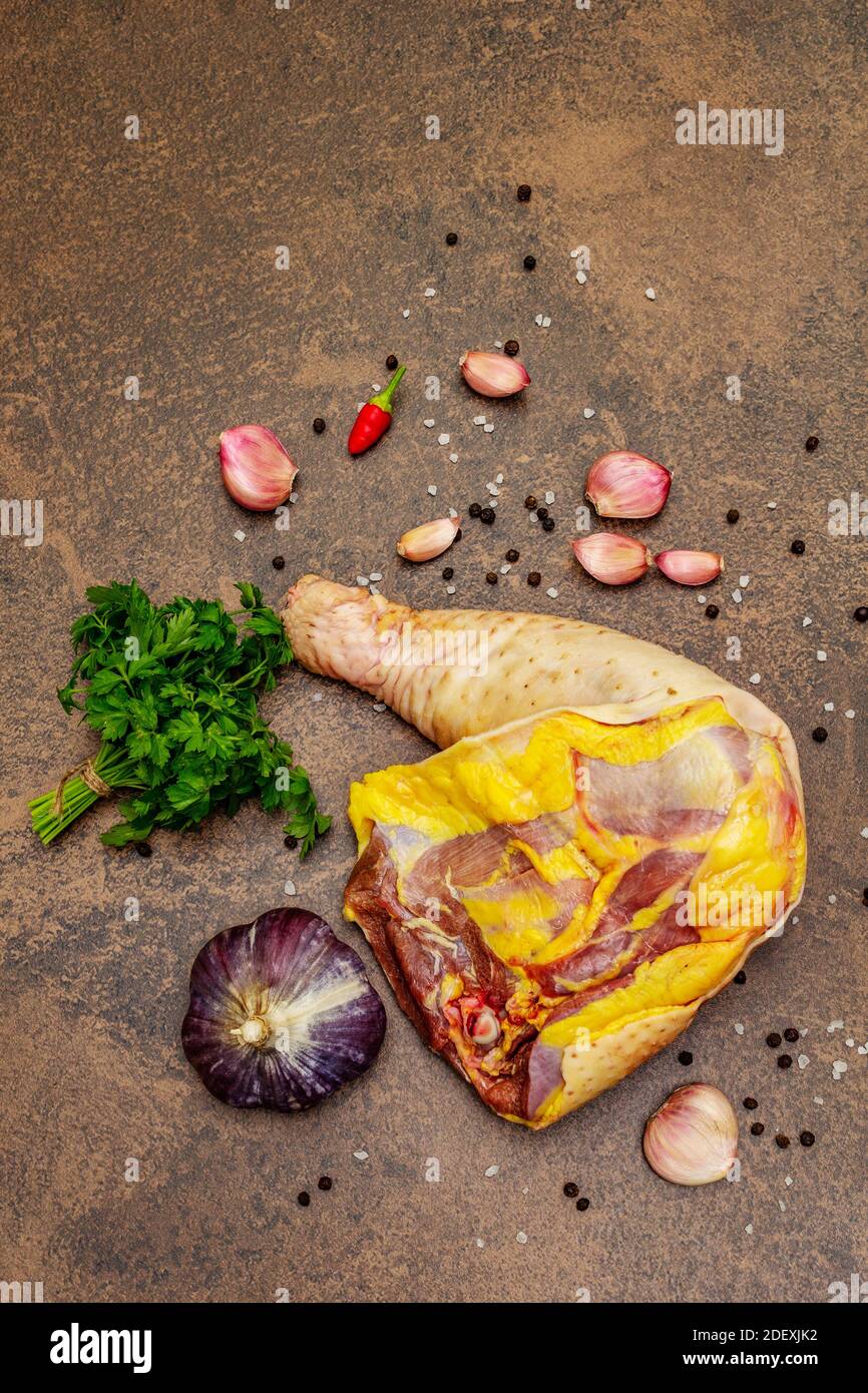 Clean food concept. Parts of organic chicken (leg) with yellowish skin ...