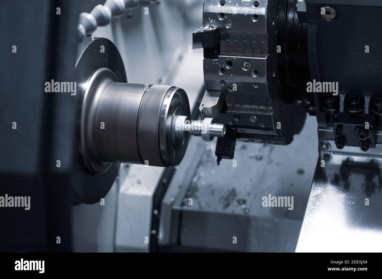 CNC lathe or turning machine cutting thread at the end of metal part ...