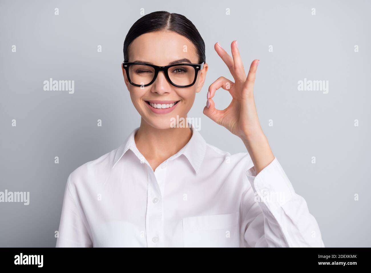 Photo of flirty coquette adviser blink eye show okey wear spectacles ...