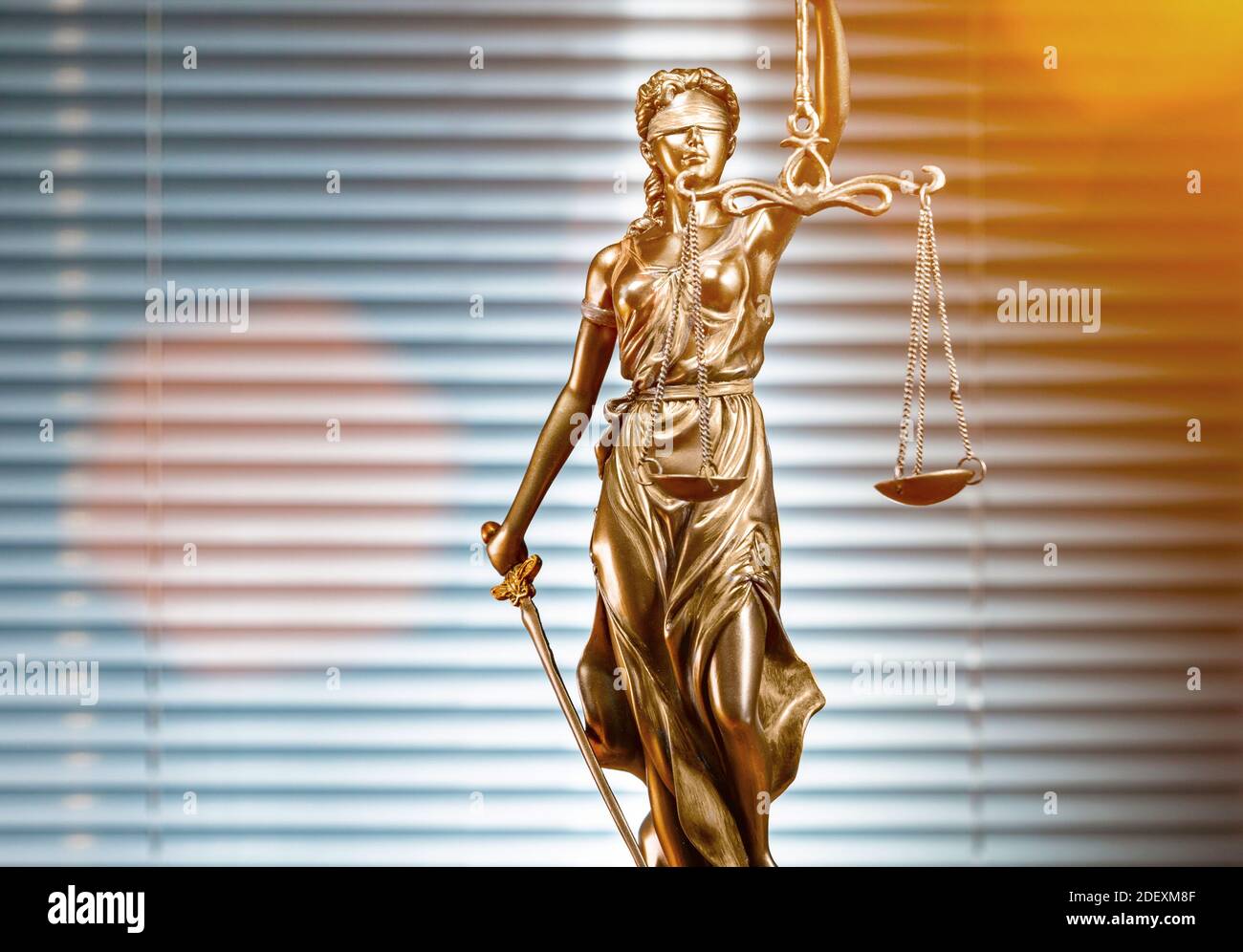 Statue of lady justice on bright background - Side view with copy space ...