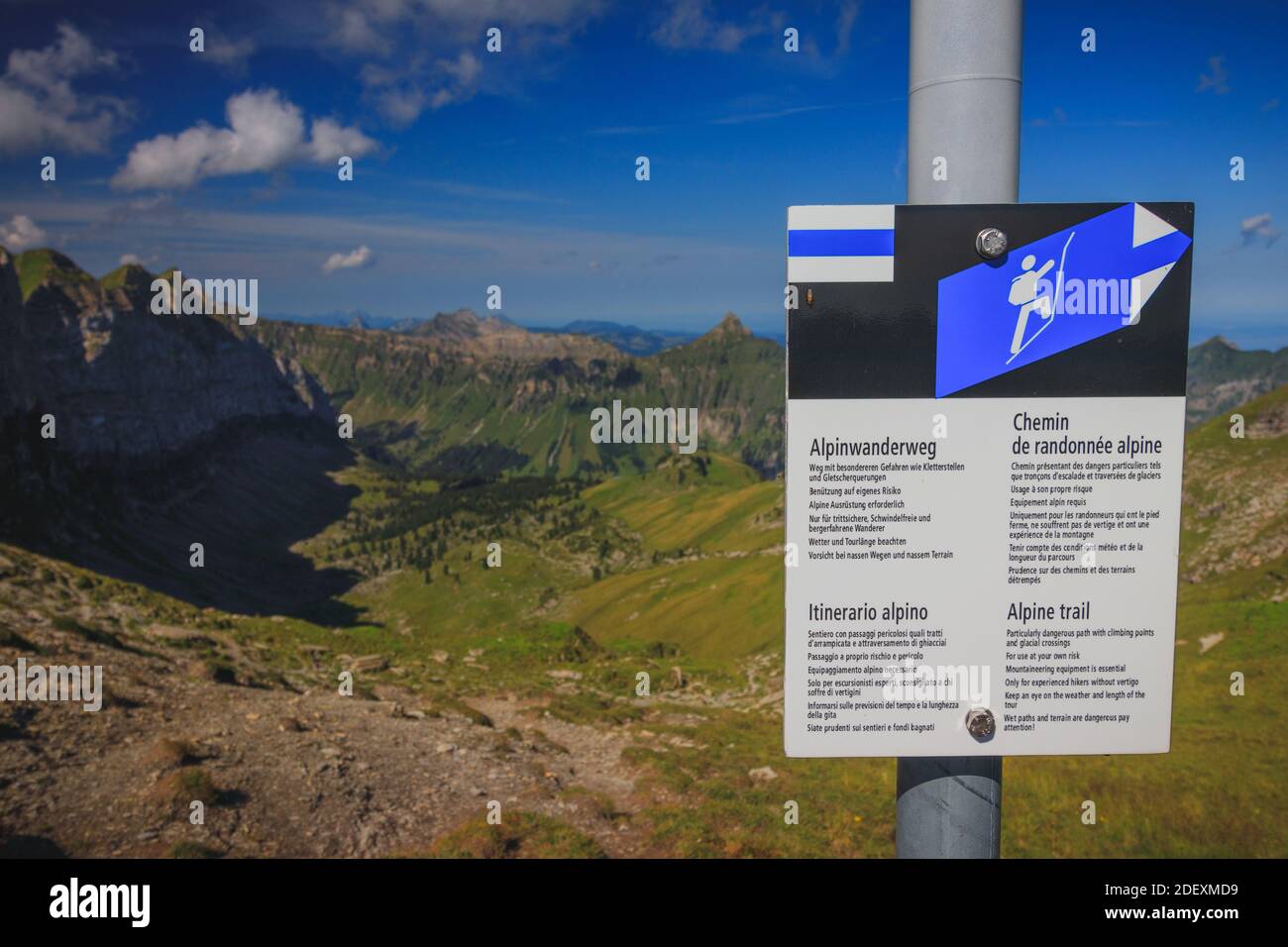 sign in the swiss alps blue path Stock Photo - Alamy