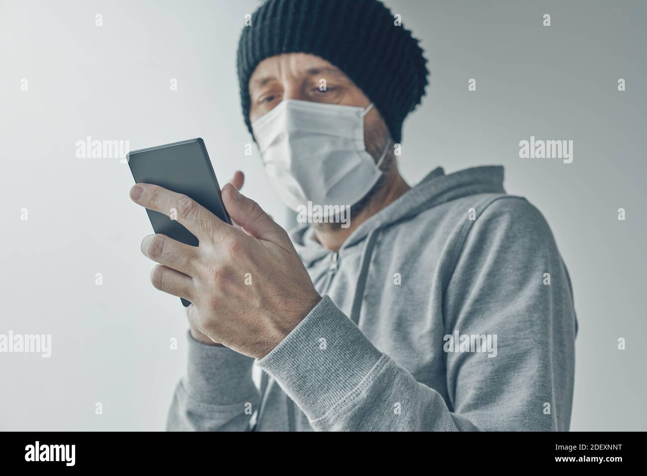 Covid-19 patient using mobile phone for communication while being self ...