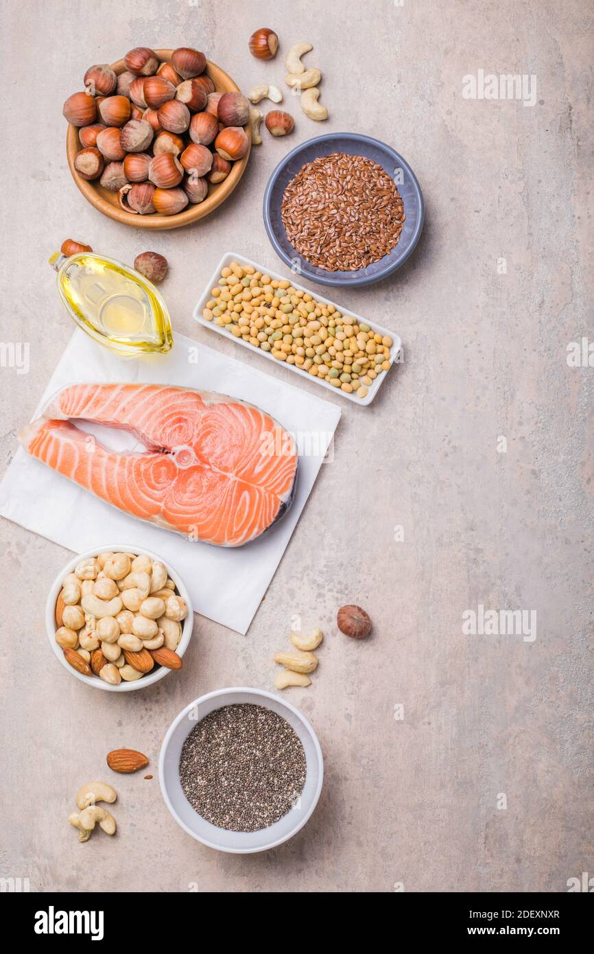 Omega 3 food sources and omega 6 on concrete background, top view copy ...
