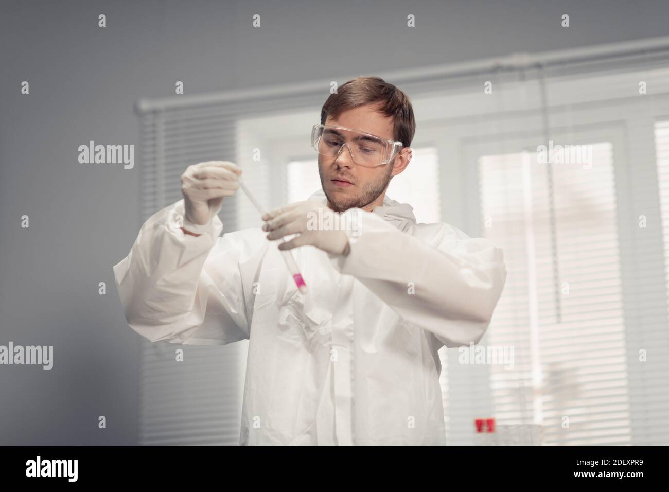A young chemical engineer working at the chemistry laboratory Stock ...