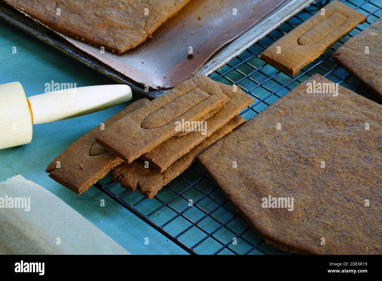 Brown gingerbread house cookie pieces drying on a rack Stock Photo - Alamy