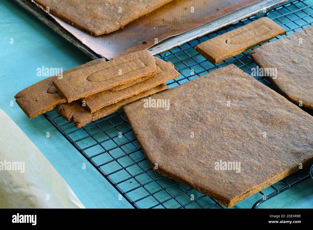 Brown gingerbread house cookie pieces drying on a rack Stock Photo - Alamy