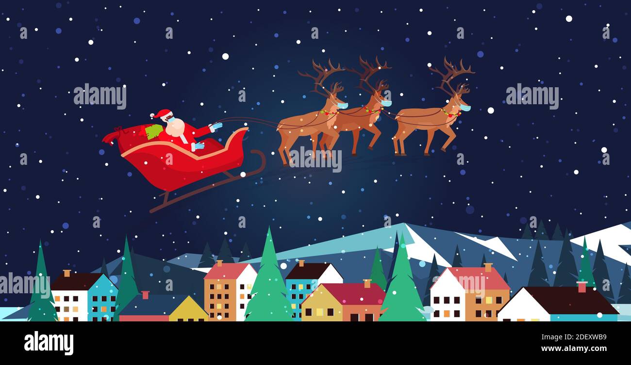 santa flying in sledge with reindeers in night sky over village houses ...