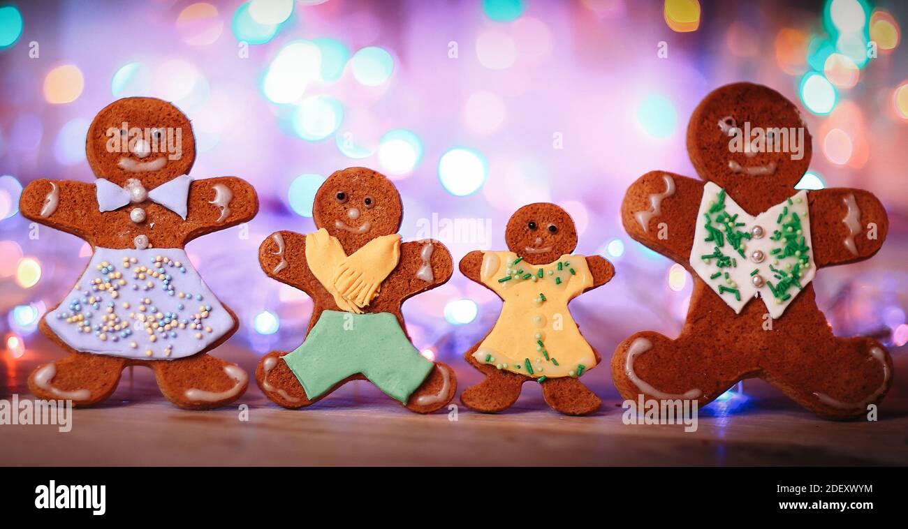 gingerbread house and gingerbread men on a festive background Stock ...