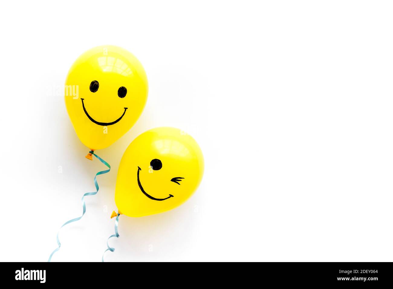 Happiness emotion face on balloon - joy mood background. Top view, copy ...