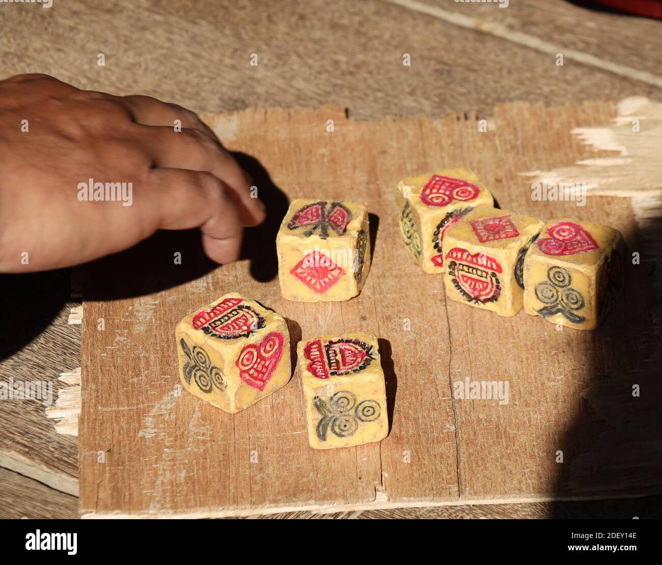kids playing a game of dice Stock Photo - Alamy